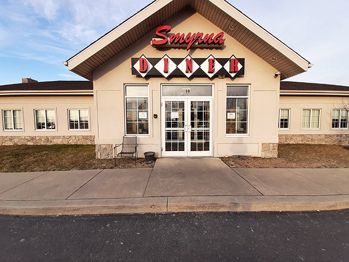 The classic diner silhouette of Smyrna Diner beckons hungry travelers like a lighthouse for comfort food enthusiasts navigating Route 13.