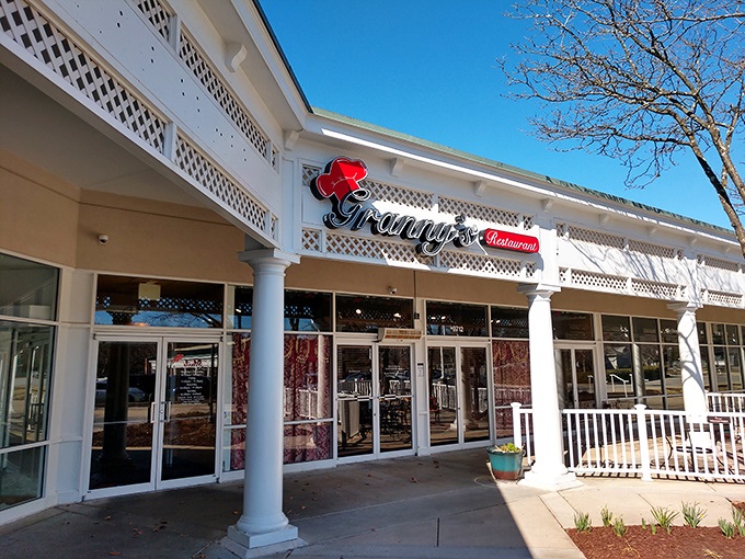 Granny's welcoming storefront promises comfort food salvation with its charming white lattice and signature red rose logo. Southern hospitality begins at the door.