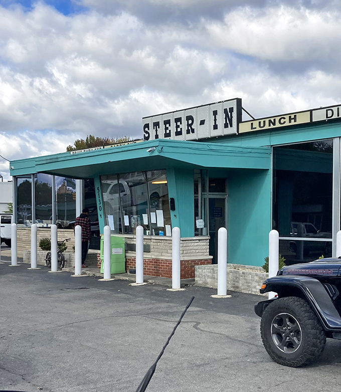 The turquoise-trimmed time machine beckons from East 10th Street, promising comfort food that actually comforts and conversations that matter.