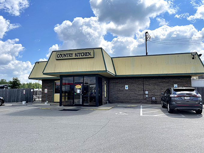 The yellow-trimmed exterior of Country Kitchen stands like a beacon of comfort food promise against the Ohio sky. No fancy architecture, just honest dining ahead.