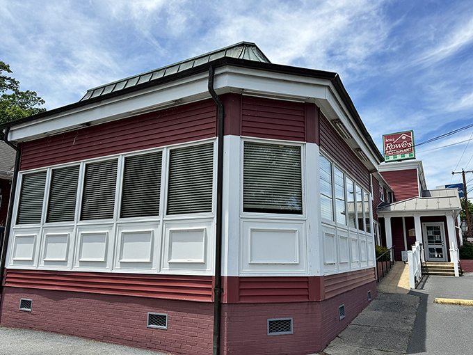 The iconic red exterior of Mrs. Rowe's stands like a beacon of comfort food hope along the highway, promising salvation for hungry travelers.