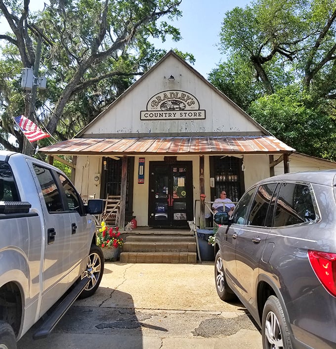 The white clapboard facade of Bradley's Country Store stands like a time capsule among the Spanish moss, beckoning hungry travelers with promises of smoky delights.