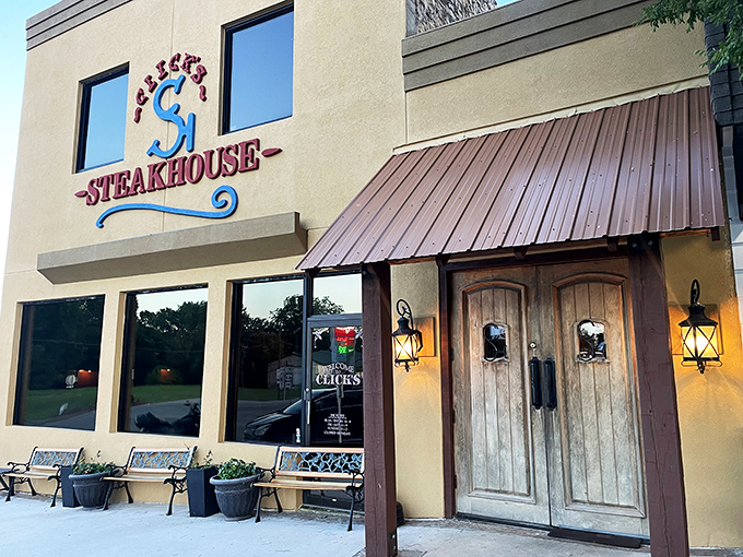 The bright yellow exterior of Click's Steakhouse stands like a beacon of carnivorous delight in Pawnee, promising beef-based bliss to those wise enough to make the journey.