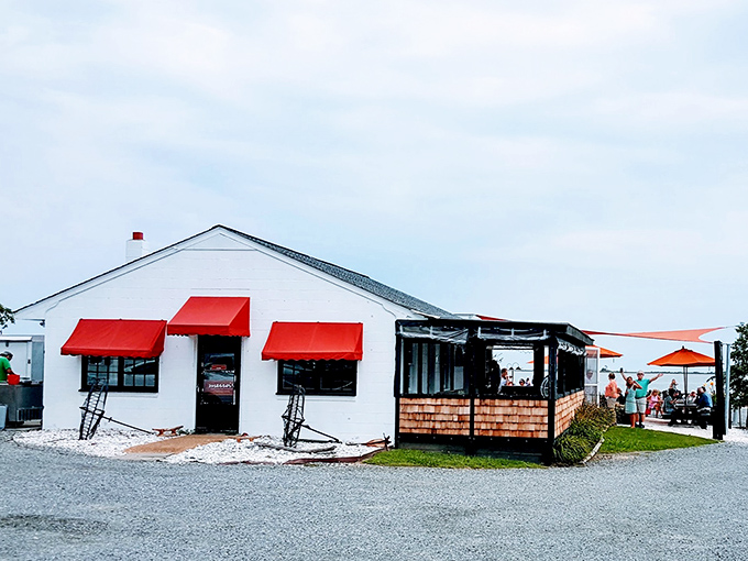 The unassuming exterior of Merroir belies the culinary magic within. Like finding a Michelin star in someone's backyard&mdash;complete with gravel parking that says "we care about food, not frills."