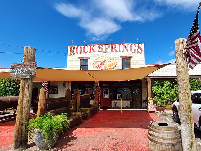 The iconic white facade of Rock Springs Caf&eacute; stands proudly against the Arizona sky, with that painted pie slice practically winking at hungry travelers on I-17.