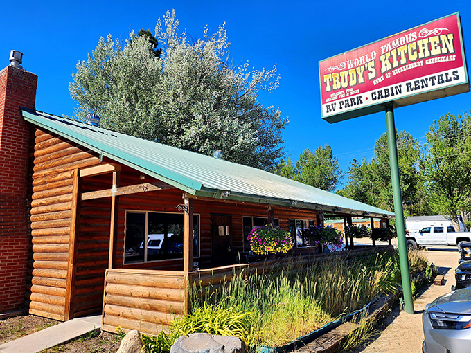 The log cabin exterior of Trudy's Kitchen stands like a delicious mirage in Idaho City, promising comfort food treasures within those timber walls.