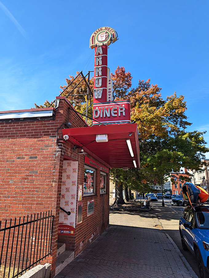 That iconic red arrow sign has been beckoning hungry travelers to this Manchester landmark since 1922, a neon North Star guiding food pilgrims home.