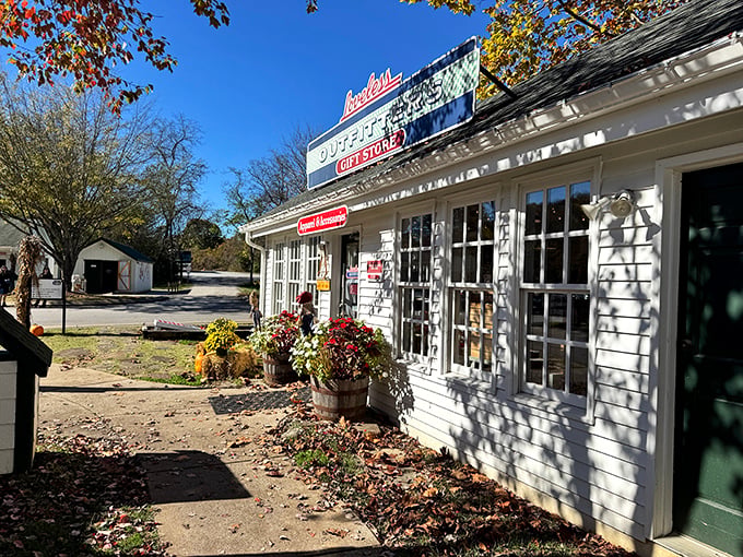 The white clapboard exterior of Loveless Cafe stands like a time capsule of Southern hospitality, complete with seasonal flower barrels and that iconic neon sign.