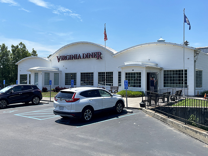The iconic white exterior of Virginia Diner stands proudly against blue skies, a beacon of comfort food that's been welcoming hungry travelers since 1929.
