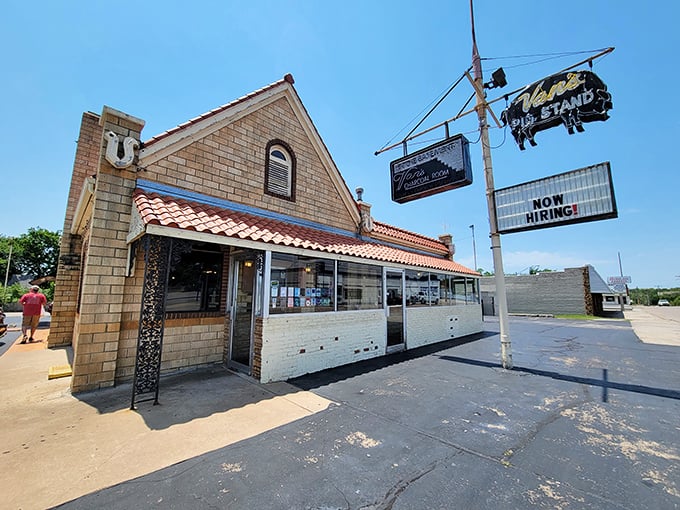 The iconic orange roof and stone exterior of Van's Pig Stand stands as a beacon of barbecue hope on Shawnee's horizon, promising smoky delights within.