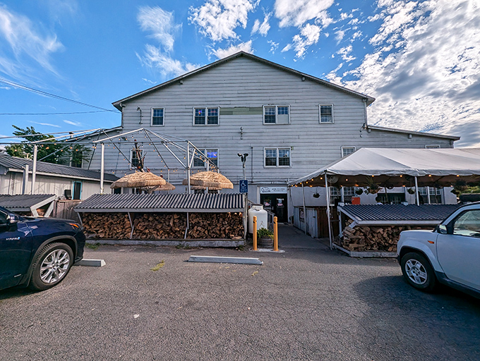 The white clapboard exterior of Monk's might seem unassuming, but those stacks of firewood tell you everything you need to know: smoke signals of deliciousness await inside.
