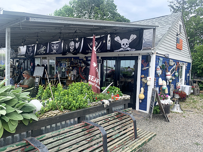Pirate flags flutter above this unassuming seafood haven, where the American flag stands tall and wooden benches await seafood pilgrims ready for treasure.