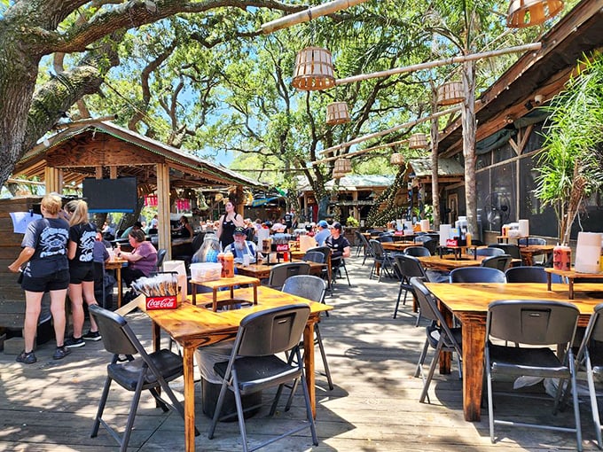 The weathered exterior of The Crab Shack stands as a beacon of seafood authenticity on Tybee Island. No fancy facades needed when what's inside is this good.