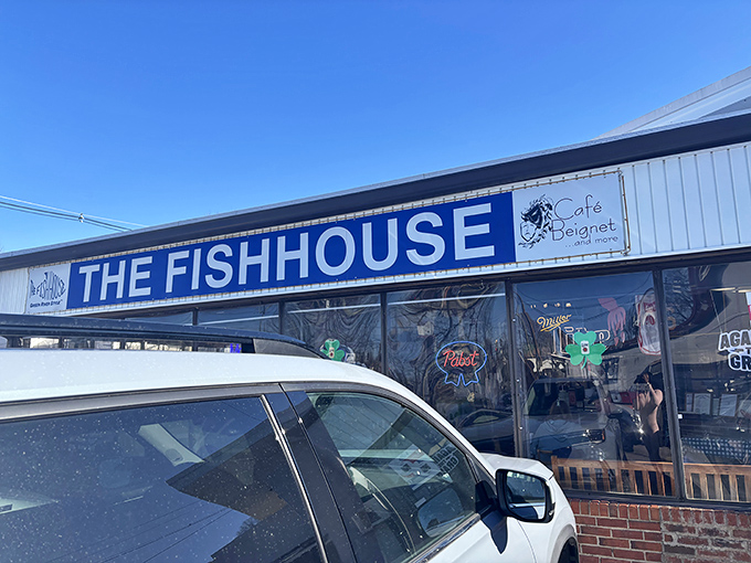 The unassuming exterior of The Fish House belies the seafood treasures within. Blue signage and simple storefront&mdash;culinary magic happens here.