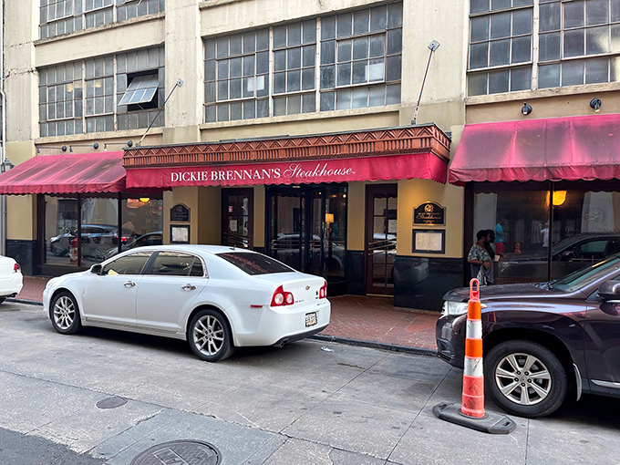 The unassuming red awning of Dickie Brennan's Steakhouse beckons from the historic French Quarter, promising culinary treasures that outshine its modest exterior.