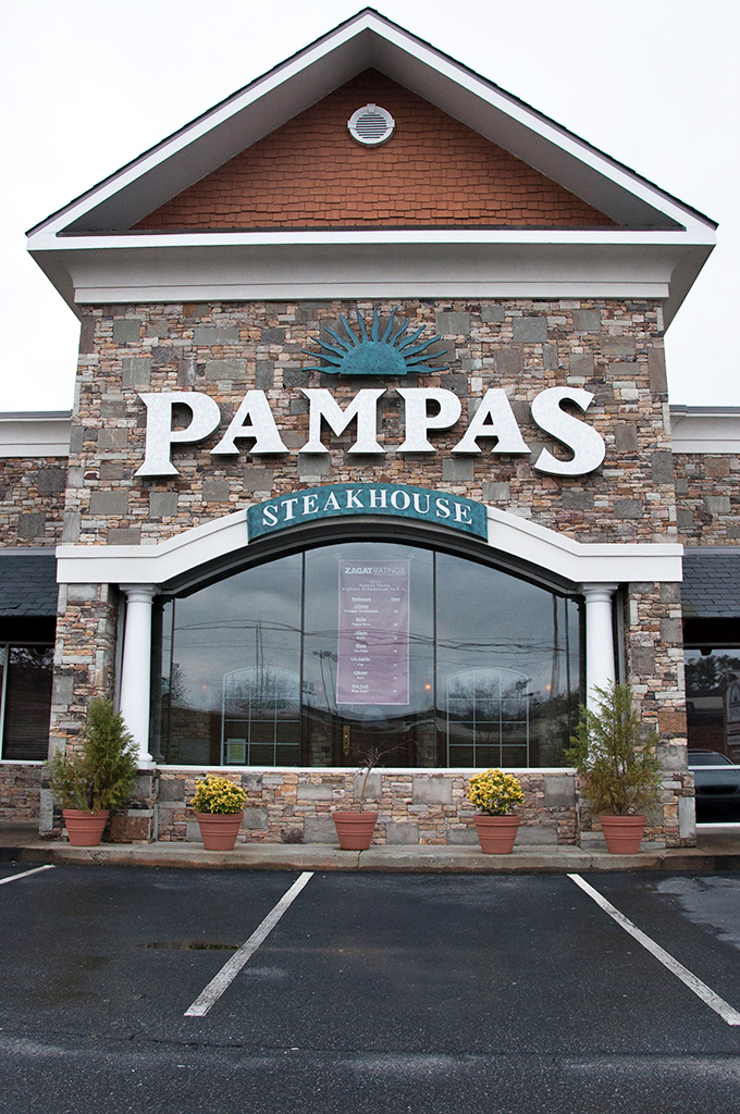 The stone facade of Pampas stands like a carnivore's cathedral in Johns Creek, promising meaty salvation within those unassuming walls.