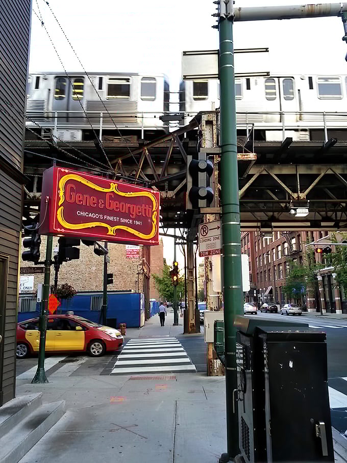 The iconic red and gold sign beckons like a lighthouse for steak lovers. Chicago's culinary history hangs right there on Franklin Street.