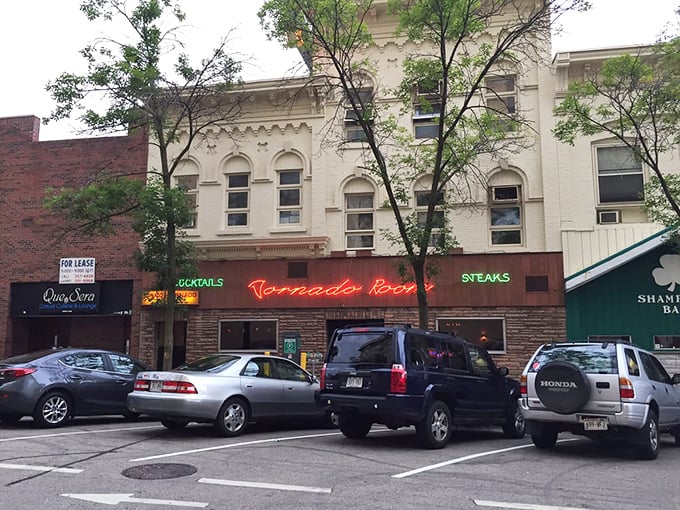 The vintage neon signage beckons hungry Madisonians like a carnivorous lighthouse, promising old-school steakhouse glory within.