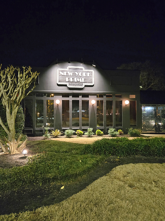 The neon glow of New York Prime beckons like a lighthouse for steak lovers&mdash;a humble exterior that belies the culinary treasures waiting inside.