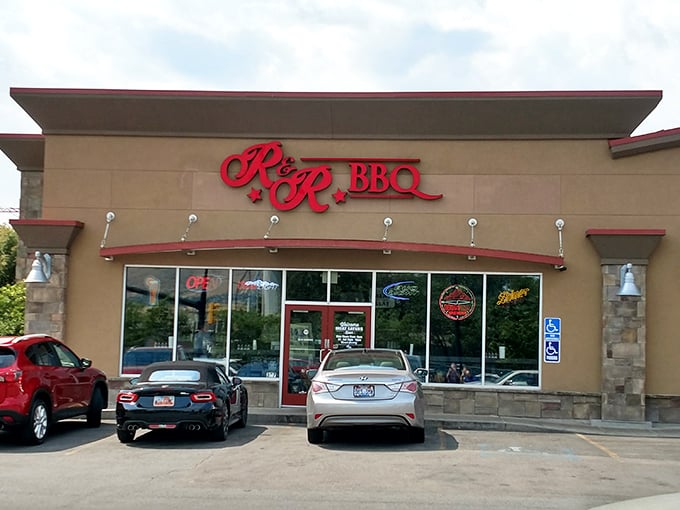 The red R&R BBQ sign beckons like a smoky siren call against the Utah sky. Simplicity on the outside belies the flavor explosion waiting within.