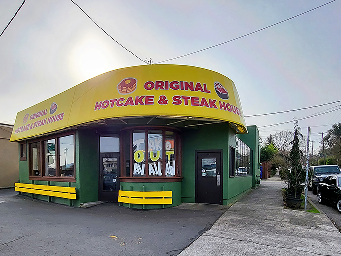 The turquoise and yellow exterior stands like a beacon of breakfast hope on Powell Boulevard, promising 24-hour satisfaction for hungry Portlanders. 