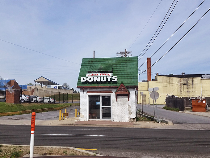 The little green-roofed donut shop that could! Laurel Tavern Donuts stands like a delicious time capsule on Washington Boulevard, beckoning sweet-toothed travelers.