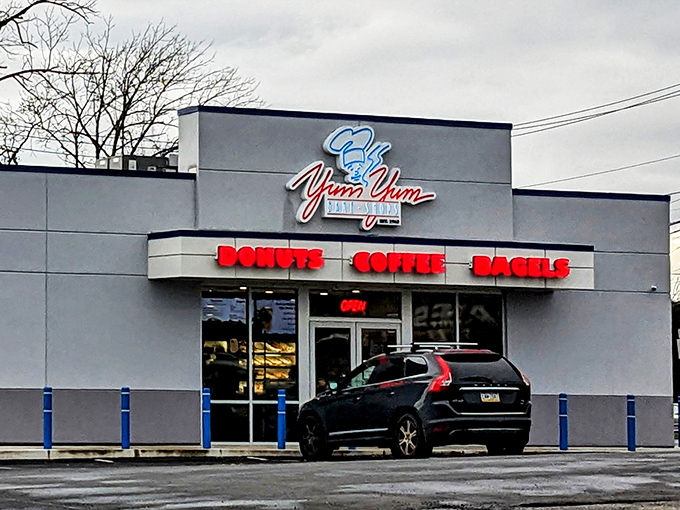 The modest white exterior of Yum Yum Bake Shop belies the sweet treasures within. No architectural frills, just a singular focus on donut perfection.