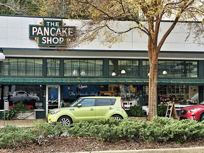 The iconic green sign beckons like a breakfast lighthouse on Hot Springs' Central Avenue, promising pancake perfection to early risers and brunch enthusiasts alike.