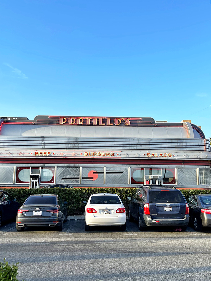 The neon-drenched exterior of Portillo's glows like a beacon of Midwestern comfort food in the Southern California night. Chicago never looked so good in California.