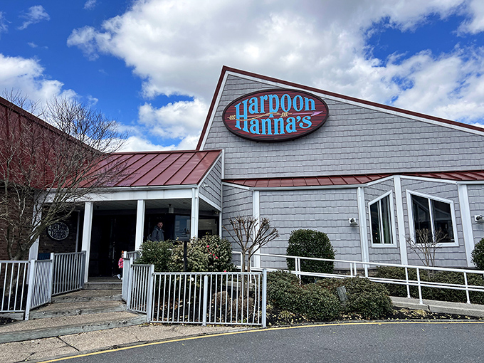 The coastal charm hits you before the first bite. Harpoon Hanna's gray-shingled exterior promises seafood treasures within, standing proudly against Delaware skies.