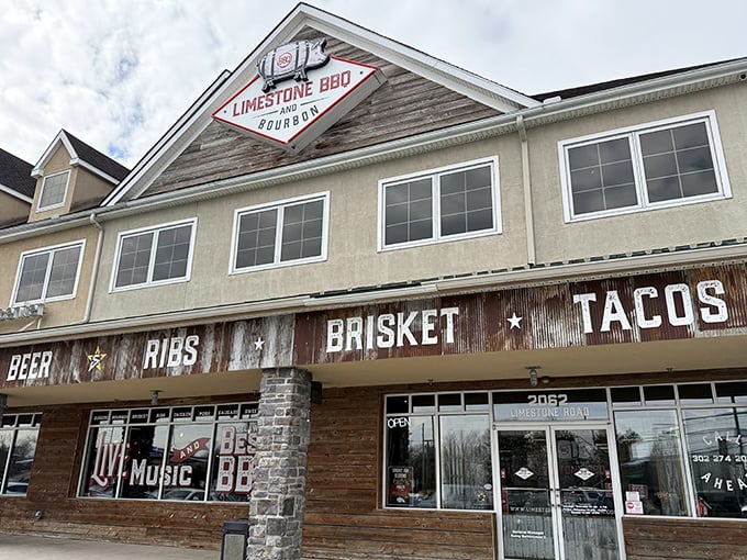 The rustic wooden fa&ccedil;ade of Limestone BBQ and Bourbon promises what every barbecue pilgrim seeks: a temple where smoke, meat, and time create magic.