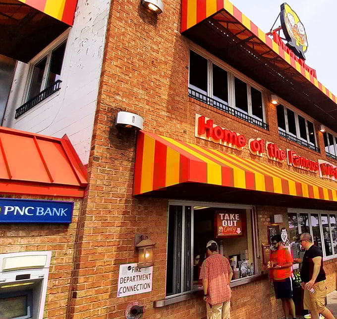 The iconic red and yellow awning of Nicola Pizza stands as a beacon of comfort food in Rehoboth Beach, promising culinary treasures within those brick walls.