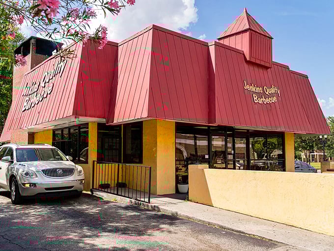 The bright yellow building with its iconic red roof stands like a barbecue beacon in downtown Jacksonville, drawing hungry pilgrims since 1957.