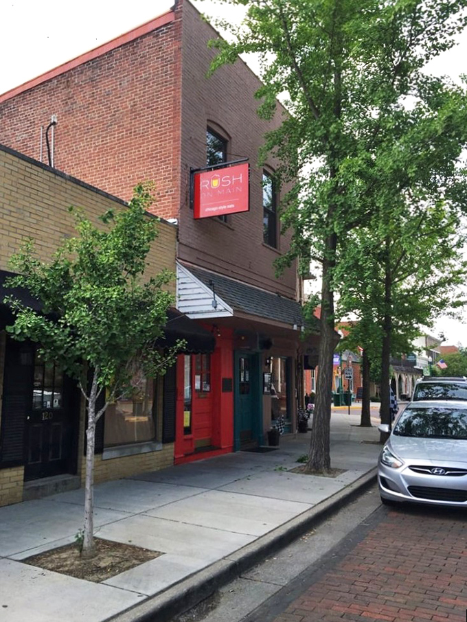 The bright red door at Rush on Main stands out like a beacon on Zionsville's Main Street, promising Chicago-style delights within these historic walls.
