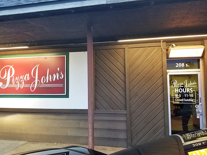 The unassuming exterior of Pizza John's in Derby might not stop traffic, but locals know this modest storefront houses pizza greatness.