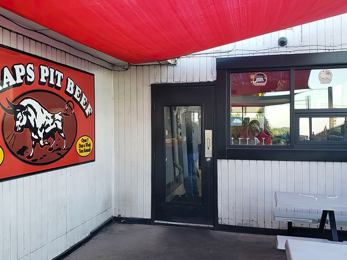 The iconic red awning and bull logo of Chap's Pit Beef welcomes meat lovers like a beacon of barbecue hope on Baltimore's Pulaski Highway.