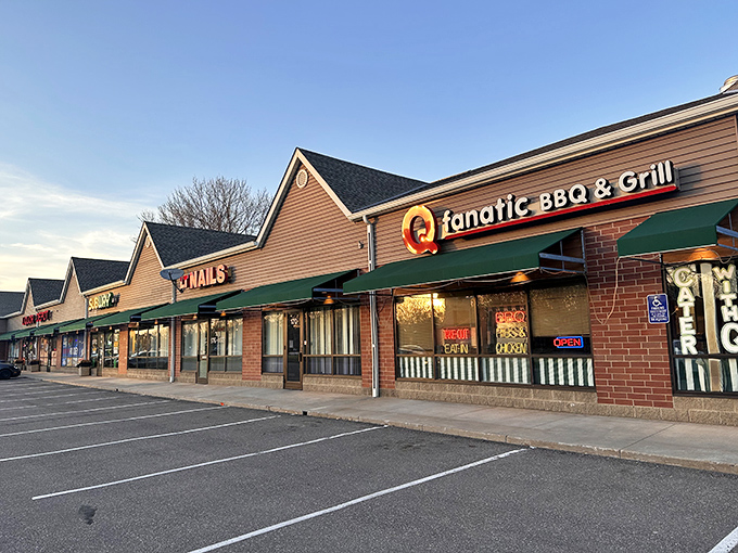 Welcome to BBQ paradise! Q Fanatic's exterior promises smoky delights, with its cheerful pig-and-cow logo acting as a meaty bat-signal for hungry patrons.