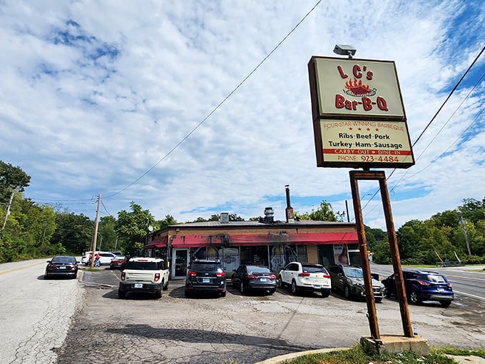 The unassuming exterior with its bright red awning houses barbecue magic that's drawn pilgrims from across Missouri for decades.