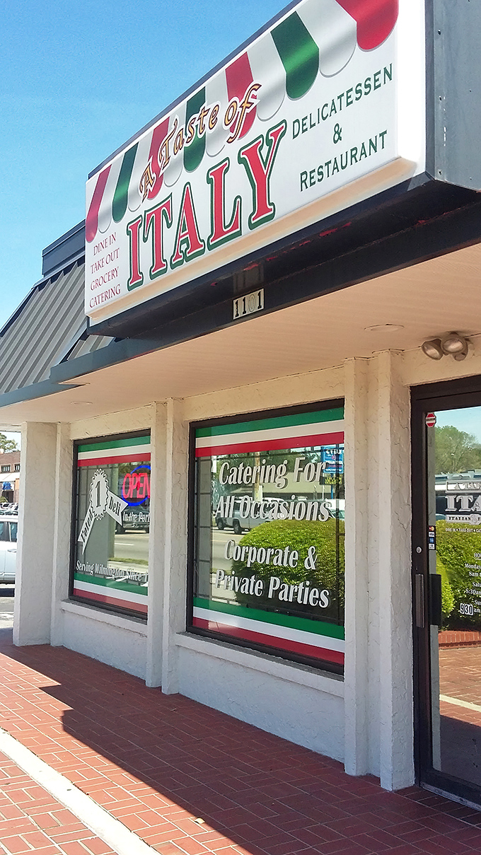 The unassuming storefront that launched a thousand food pilgrimages. Italian colors proudly announce what awaits inside: culinary authenticity without pretense. 