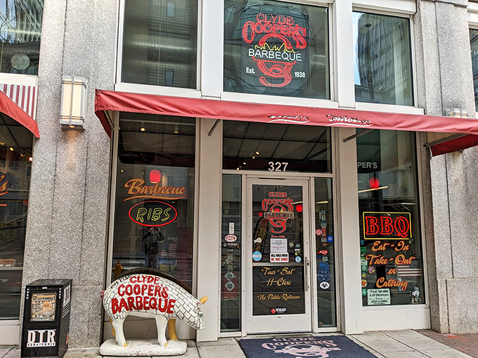 The neon glow of Clyde Cooper's storefront is like a lighthouse for hungry barbecue pilgrims, beckoning from downtown Raleigh since 1938.