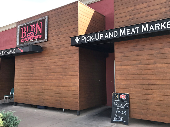 The wooden facade of barbecue paradise beckons with its bold red sign &ndash; a siren call to meat lovers that promises smoky delights within.