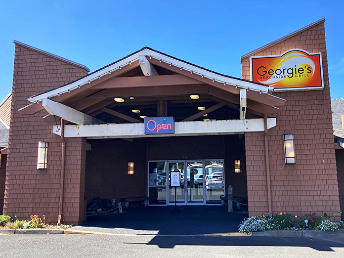 Cedar-shingled charm meets coastal elegance at Georgie's entrance, where the promise of seafood treasures awaits just beyond those welcoming doors. 
