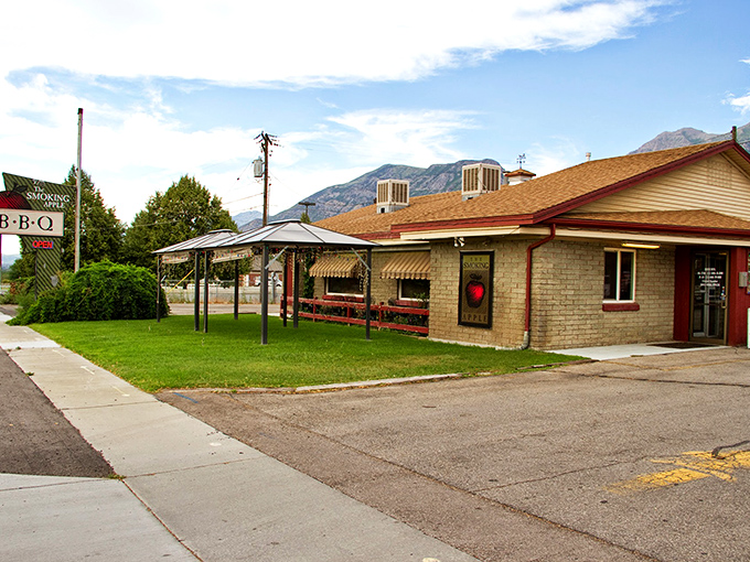 The promise of transcendent barbecue awaits in this unassuming brick building, where Utah's Wasatch Mountains provide the perfect dramatic backdrop for smoke-fueled culinary magic.
