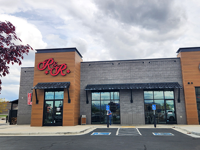 The red R&R BBQ sign beckons like a smoky siren call against the Utah sky. Simplicity on the outside belies the flavor explosion waiting within.