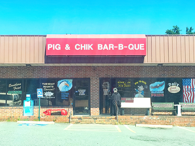 The bright red sign beckons like a barbecue lighthouse in a sea of hunger. No fancy frills here&mdash;just the promise of smoky delights waiting inside.