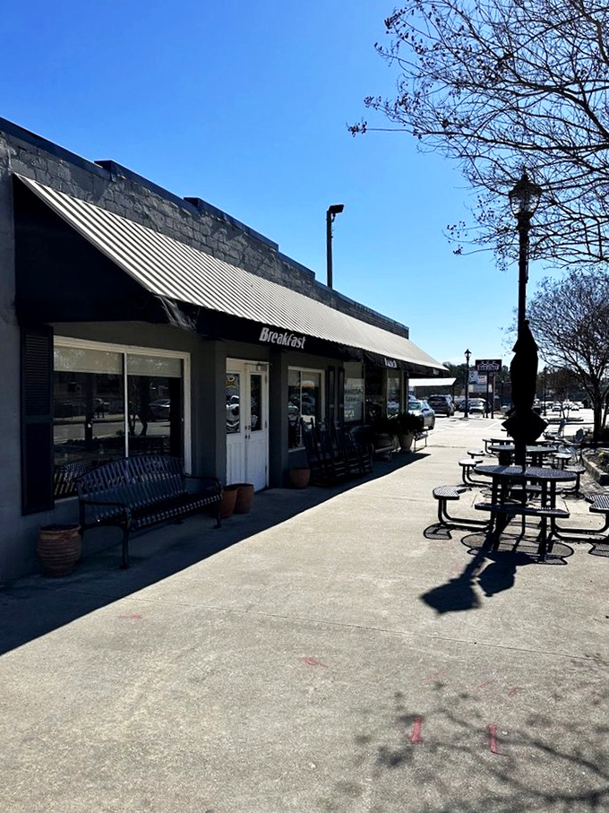 The unassuming exterior of Matthews Cafeteria stands like a time capsule on Tucker's Main Street, promising comfort food that transcends decades.