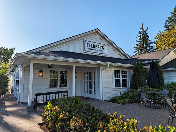 The classic white farmhouse exterior of Filberts beckons like an old friend, promising comfort food that'll make you forget your troubles at the door. 