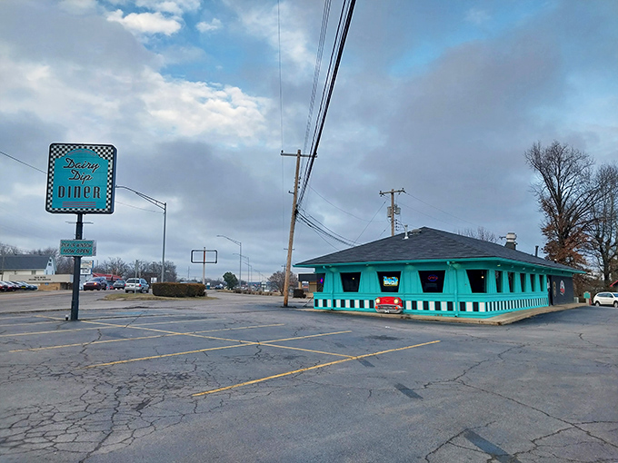 That unmistakable turquoise exterior isn't just a building&mdash;it's a time portal disguised as a diner. The Dairy Dip's vintage sign practically winks at passersby.