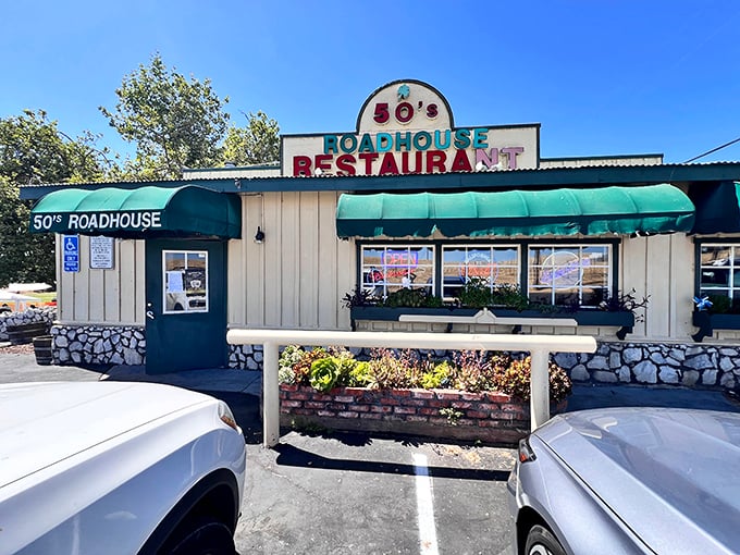 The classic roadside charm of 50's Road House beckons with its vibrant signage and green awnings&mdash;a time portal disguised as a restaurant in Knights Ferry.