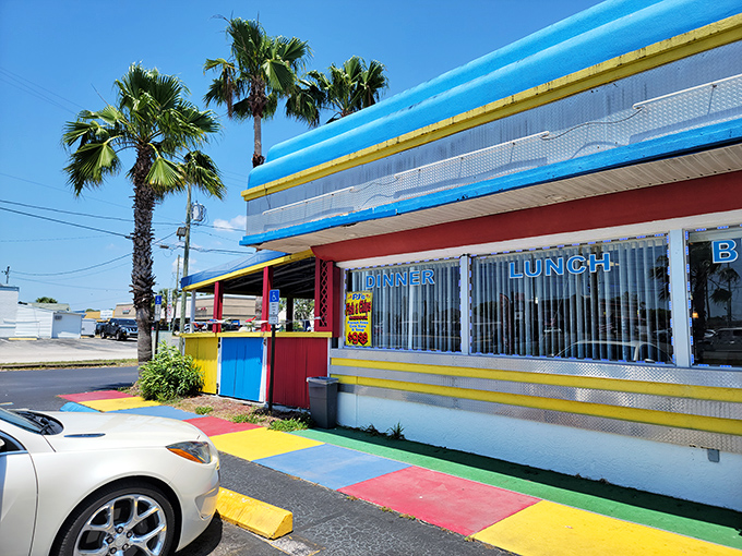 The technicolor dreamcoat of diners! Americana 50's Family Diner's exterior pops against the Florida sky like a Technicolor postcard from the past.
